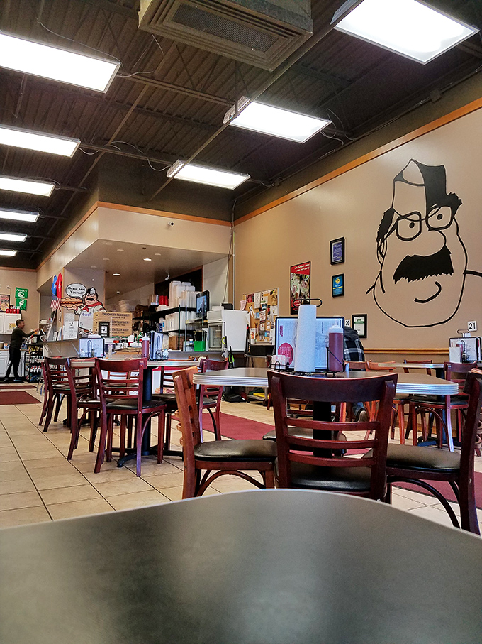 The dining room where memories are made. That cartoon mascot on the wall has witnessed countless first bites of sandwich perfection.