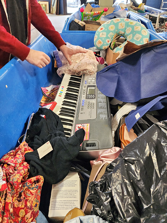 A keyboard buried in textile treasure - just waiting for the next garage band or aspiring Elton John to give it a loving home.