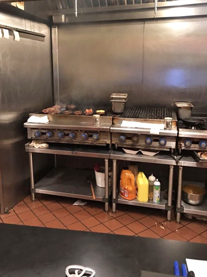 The beating heart of burger perfection: a well-seasoned grill that's seen thousands of patties reach their delicious destiny. Kitchen magic in action.