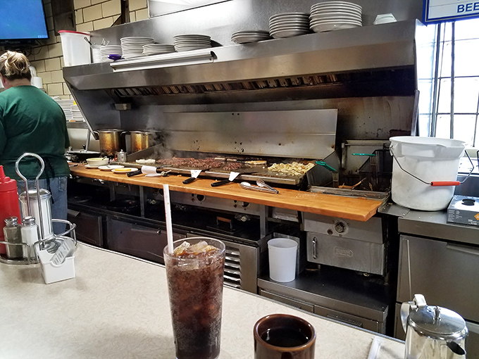 The kitchen where magic happens. No tweezers or foam in sight, just skilled hands creating honest food that satisfies the soul.
