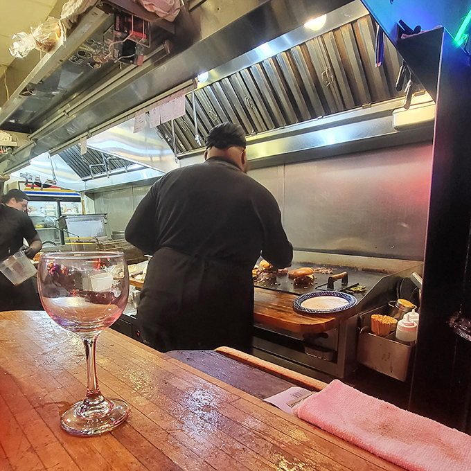 A glimpse behind the curtain where burger magic happens. That wooden bar has witnessed countless "first bite" moments of pure joy.