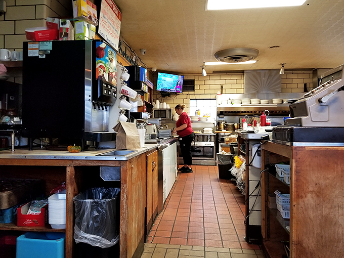 The kitchen where the magic happens &ndash; no fancy equipment, just well-seasoned cookware and decades of know-how. Some of the best meals come from the simplest kitchens.