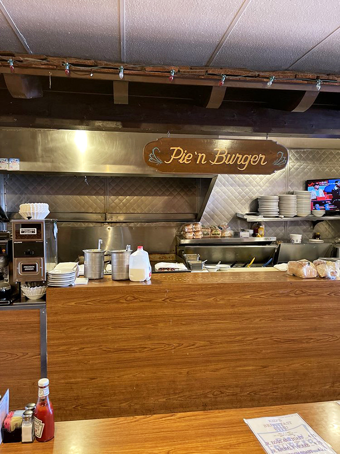 The kitchen sign hangs like a promise above the pass, where burgers and pies have been crafted with the same care for generations.
