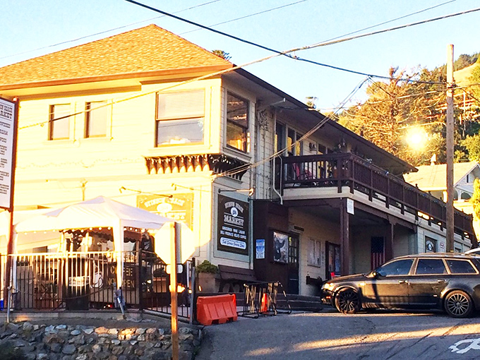 Golden hour bathes the village in magical light, transforming even the most ordinary market building into something from a California dream.