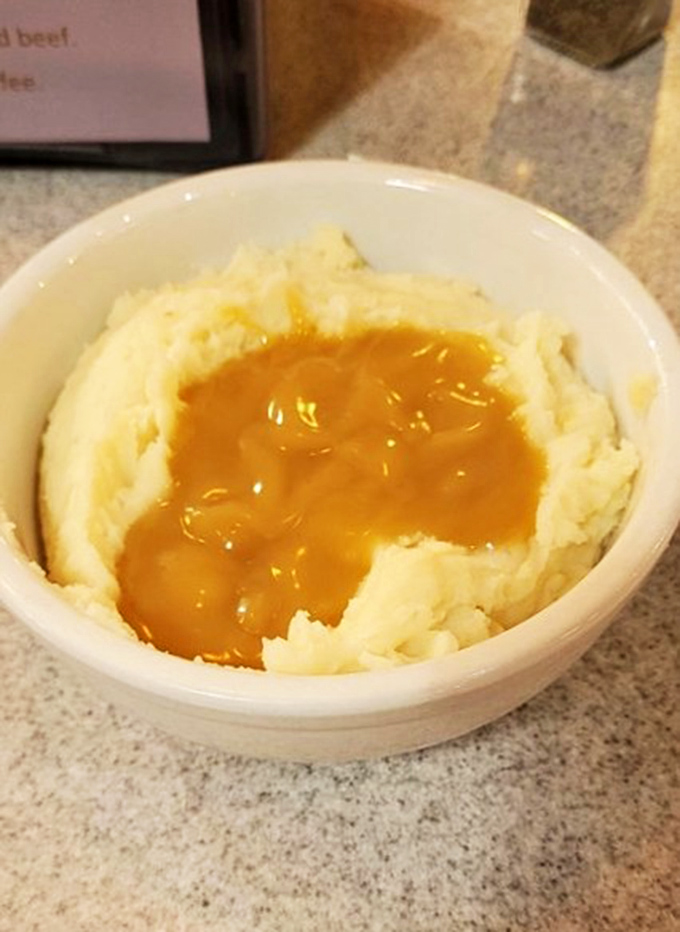 Mashed potatoes with a golden pool of gravy&mdash;the kind that makes you want to call your mother and apologize for ever saying anyone's were better.
