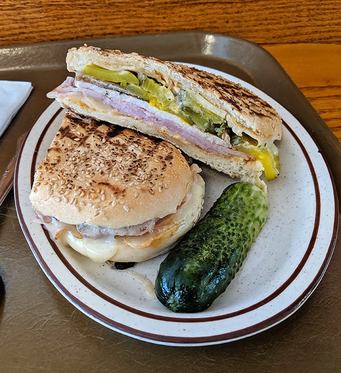 The perfect pickle companion stands guard beside sandwiches that make you wonder why you ever settled for lesser lunch options.