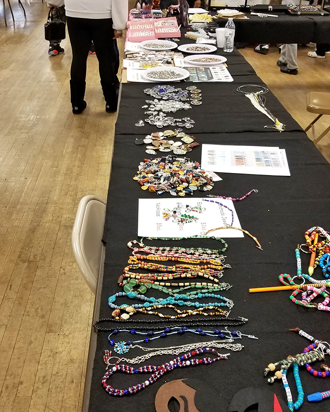 Handcrafted jewelry displayed like colorful fishing lines cast into a sea of potential buyers. Each strand tells a different story.