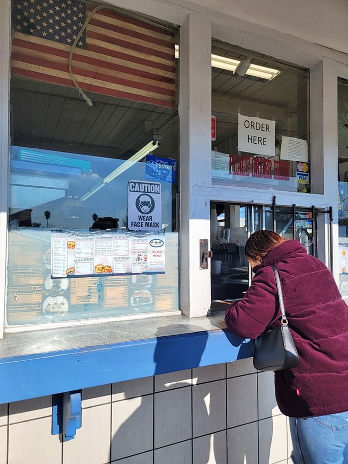 The ordering window&mdash;where dreams come true and diet plans go to die. Worth every calorie and every minute in line.
