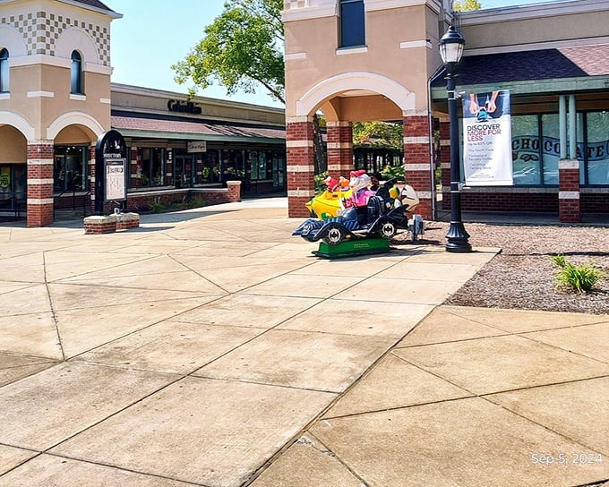 The outdoor plaza's design elements create breathing room between shopping sprints, with ride-on attractions that keep younger visitors entertained.