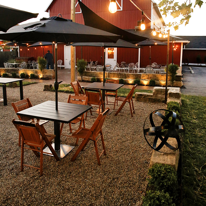Outdoor seating where summer evenings become magical under string lights. Ohio's countryside provides the perfect dinner theater backdrop.