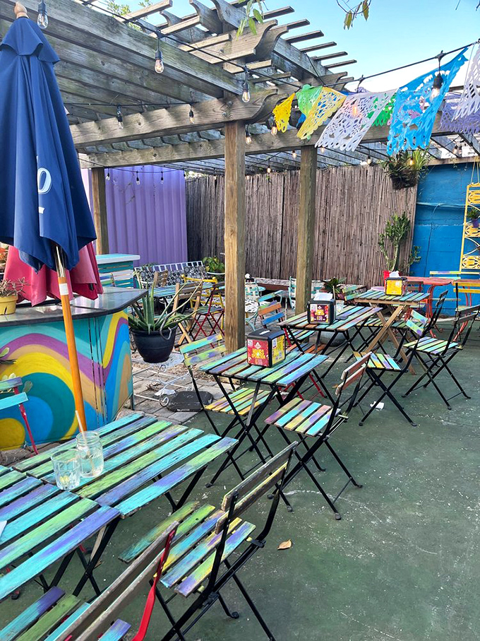 Rainbow tables under Florida skies! This technicolor outdoor seating area feels like dining inside a box of crayons&mdash;in the best possible way.