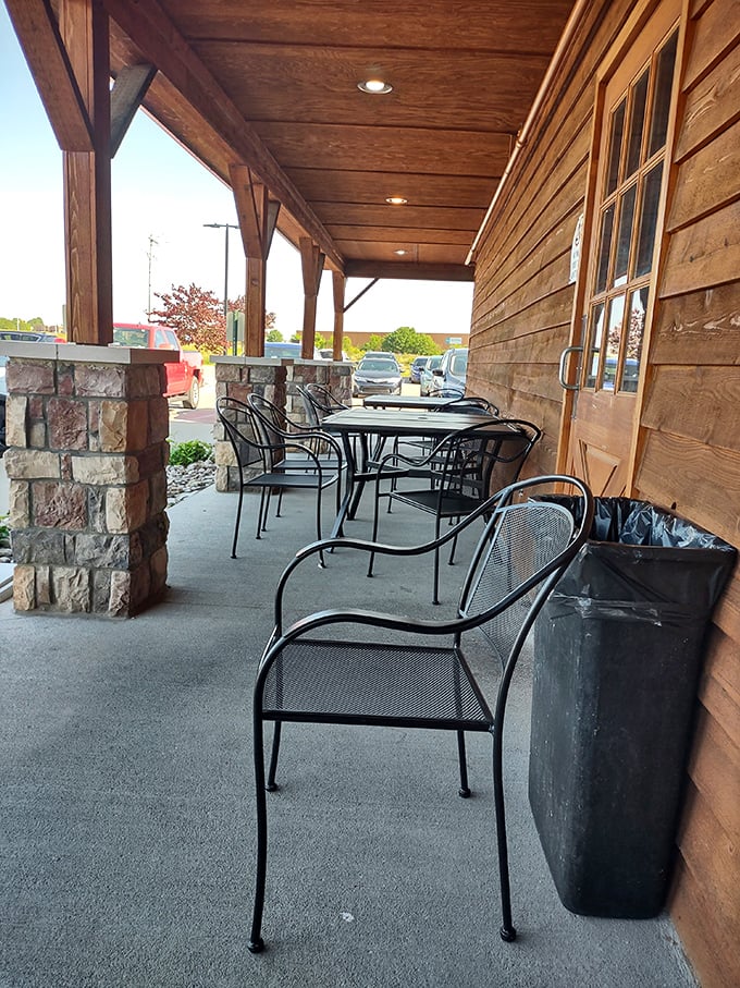 The covered porch offers a moment of quiet contemplation before or after the main event. Those metal chairs have heard many satisfied sighs.