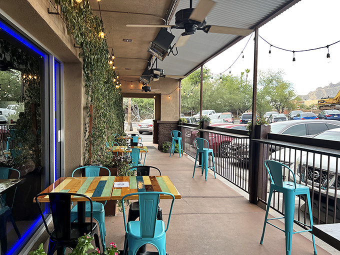Arizona evenings were made for patios like this. Those turquoise chairs practically whisper "stay for one more round."