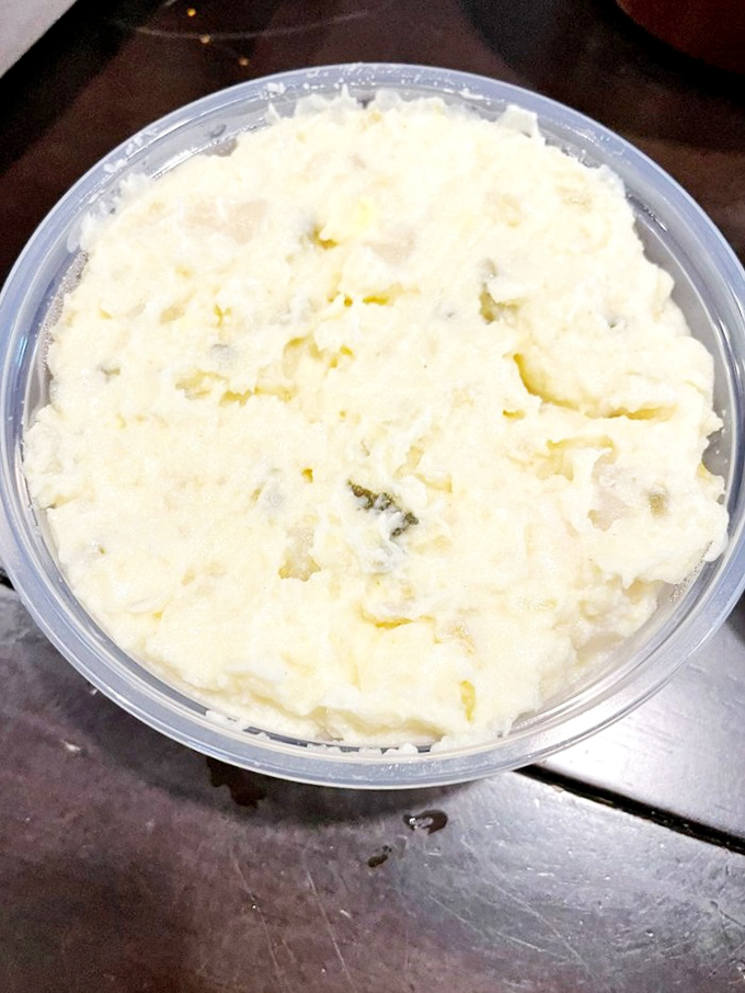 Potato salad that found the perfect balance between creamy and substantial. The Switzerland of sides—neutral territory everyone can agree on.