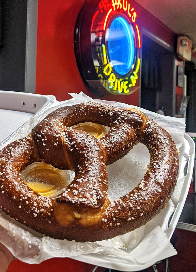 The pretzel that puts mall versions to shame. Warm, soft, dusted with powdered sugar, and those pools of dipping sauce are basically little lakes of joy.