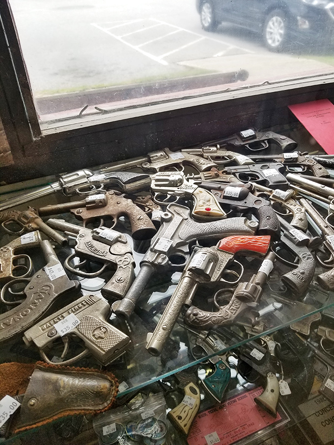 A collection of vintage firearms that would make any Western film director swoon. Each one a piece of American history behind glass.