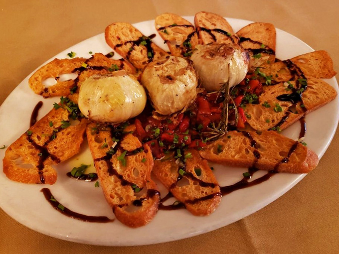 Roasted garlic and grilled bread&mdash;the opening act that sets the stage for the culinary concert to follow.