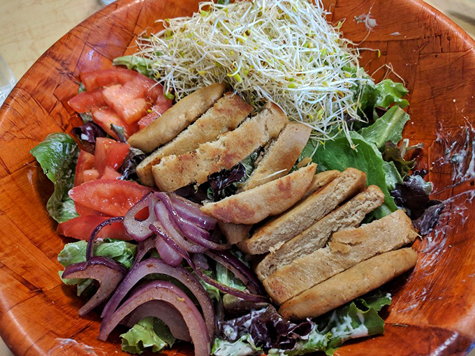 This salad with its perfectly arranged protein strips isn't just lunch &ndash; it's edible architecture with sprouts as the penthouse.