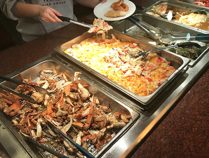 The moment of truth at the seafood station – where decisions are made, plates are filled, and diet plans are temporarily suspended.