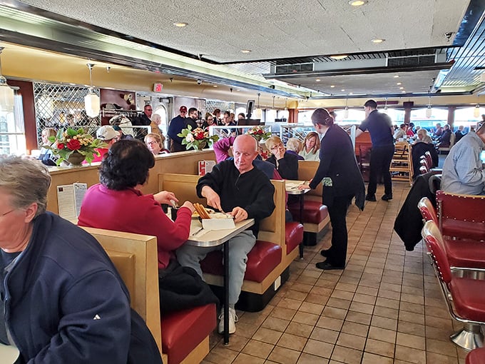 The dining room hums with conversation and silverware symphonies as regulars and newcomers alike share the universal language of good food.