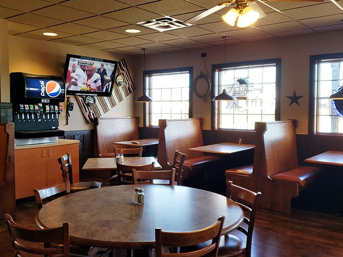 Cozy booths await your barbecue coma, strategically positioned for optimal meat consumption and post-feast relaxation.