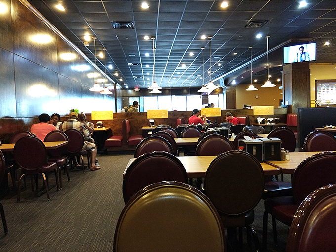 The dining room, with its comfortable booths and tables, stands ready for the inevitable food coma that follows ambitious plate-filling expeditions.