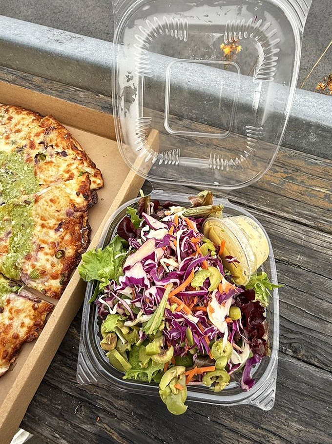 A rainbow of vegetables accompanies your pizza. Because even in paradise, you should probably eat a vegetable.