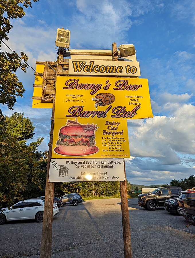 This sign isn't just giving directions&mdash;it's issuing a challenge to hungry travelers with its siren call of legendary burgers.