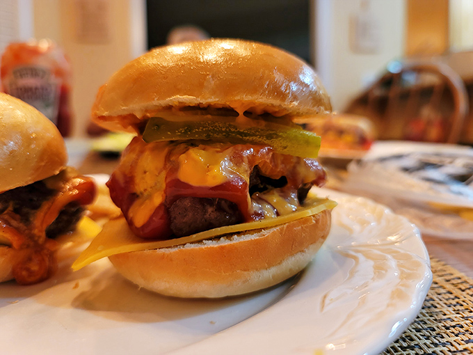 This isn't just a burger&mdash;it's a masterpiece of comfort food engineering. The pickle adds that perfect tangy counterpoint to all that richness.