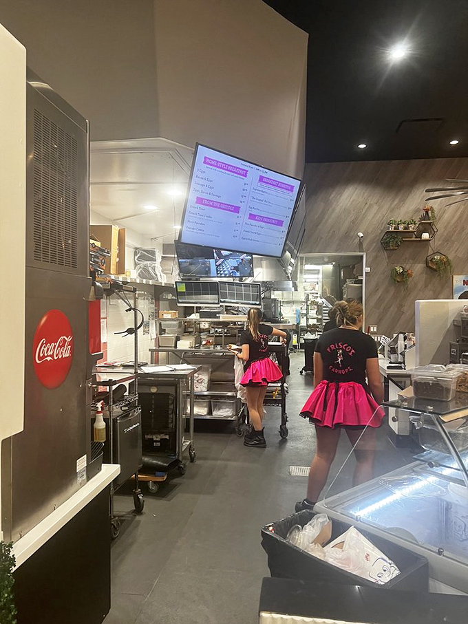 Behind the scenes where the magic happens&mdash;pink-skirted uniforms adding that perfect touch of nostalgia to modern efficiency.
