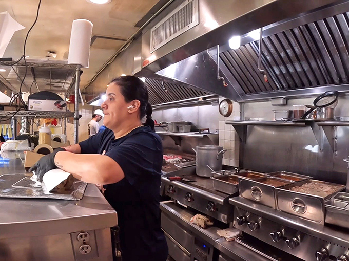 Behind every legendary sandwich stands a team of skilled hands, moving with the practiced precision that only comes from true mastery.