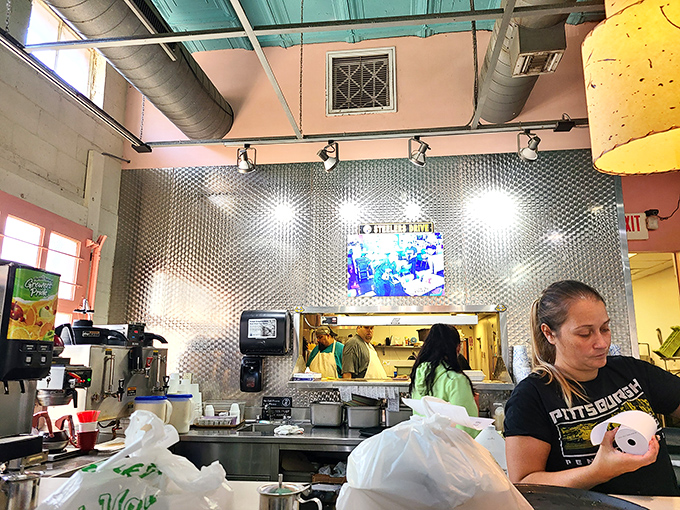 Behind every great breakfast is a kitchen crew orchestrating morning magic. That metallic wall isn't decoration&mdash;it's a badge of diner authenticity.
