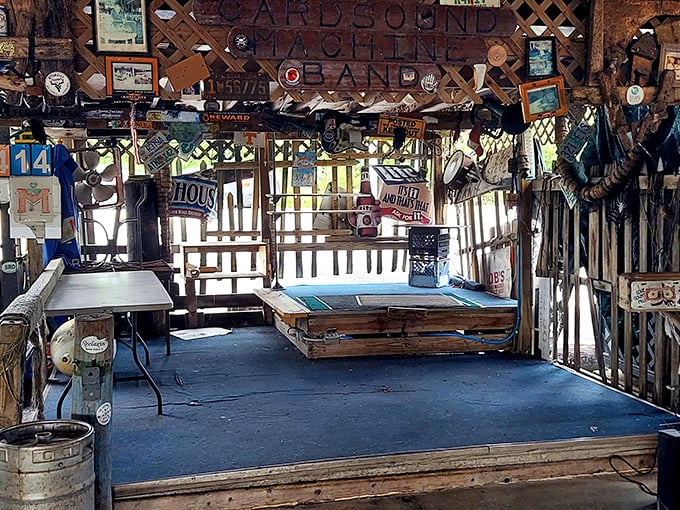 A stage awaiting its next performer, surrounded by enough maritime memorabilia to outfit a small navy. Music sounds better over water.