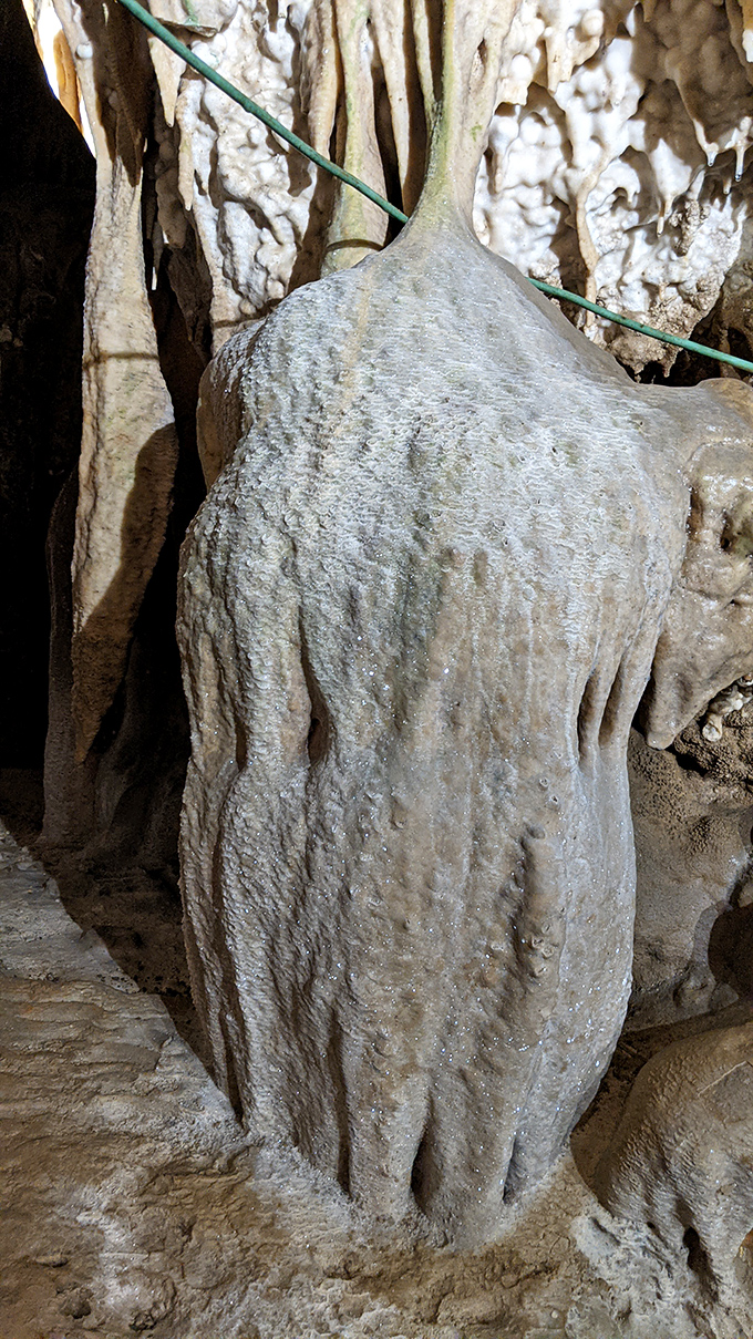 This stalagmite looks like it's auditioning for a role in a fantasy film&mdash;the wise old stone sage waiting to dispense advice.