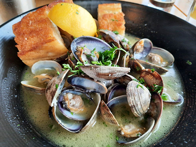 Steamed clams swimming in broth so good you'll contemplate drinking it like soup. The bread isn't a side&mdash;it's an essential dipping tool.