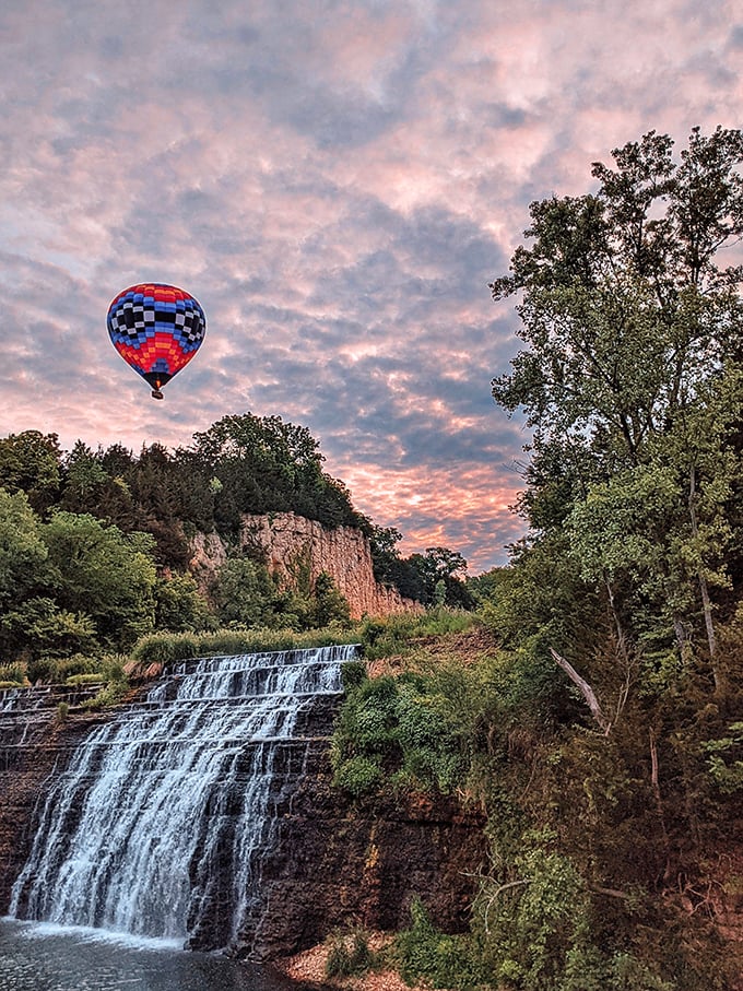 Hot air balloon meets cool falling water at sunset &ndash; a scene so perfectly composed it looks like Illinois hired a Hollywood set designer.