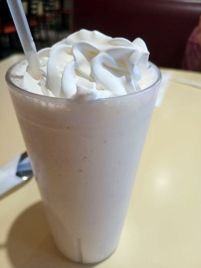 This vanilla shake topped with whipped cream swirls represents everything wonderful about old-school diner dessert perfection.