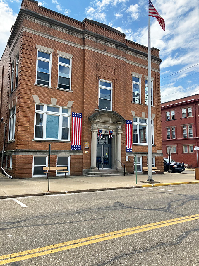 The Village Hall stands proudly decorated with American flags, embodying small-town governance where decisions are made by neighbors rather than distant bureaucrats.