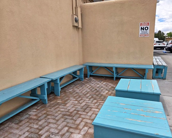 The turquoise waiting benches outside aren't just seating &ndash; they're where friendships form over shared anticipation of what's cooking inside.