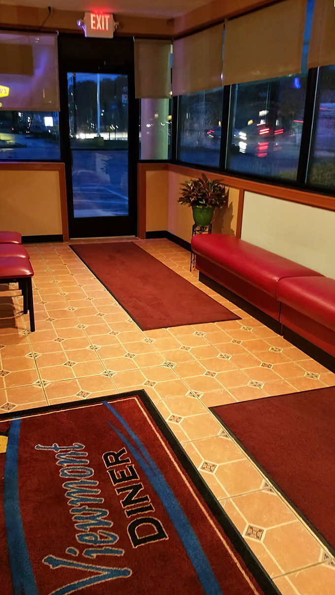 The entrance area isn't just functional&mdash;it's the threshold between ordinary life and diner magic. That custom floor mat welcomes you to the comfort zone. 