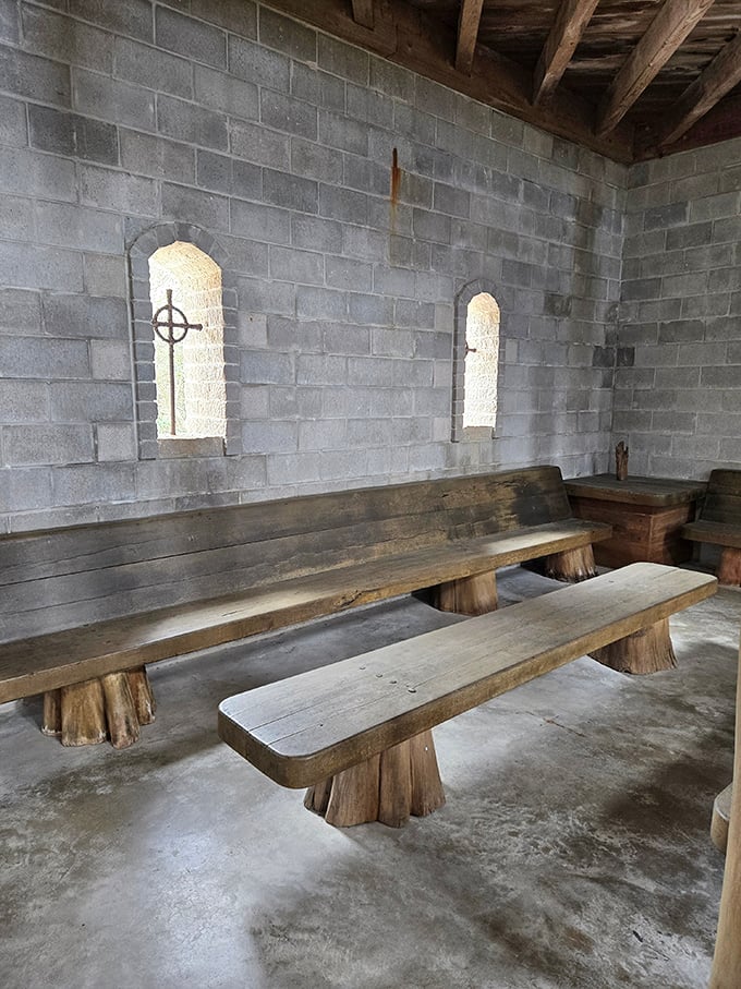 Simple wooden benches offer visitors a place to sit and contemplate, proving that medieval seating and modern comfort rarely overlap.