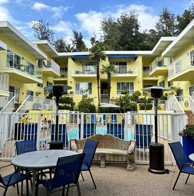 Sunny California welcome! The Magic Castle Hotel's bright yellow exterior offers a cheerful contrast to traditional castle aesthetics.