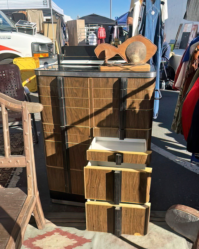 This mid-century cabinet with sleek lines and warm wood tones would make Marie Kondo weep with organizational joy.