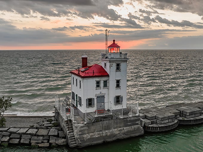 Sunset transforms the white lighthouse into a glowing ember on Lake Erie's edge&mdash;proof that Mother Nature is still the best lighting designer.