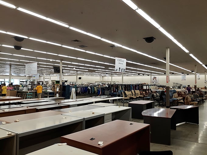 Office furniture stands in orderly rows, like corporate soldiers awaiting deployment to home offices and startups across Durham.