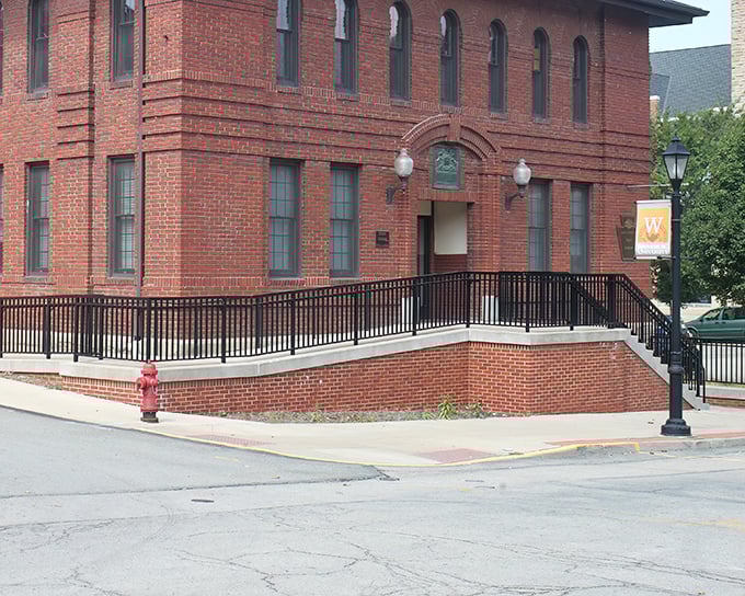 This stately brick building with its elegant entrance ramp embodies Waynesburg's blend of accessibility and tradition. History with handrails. 