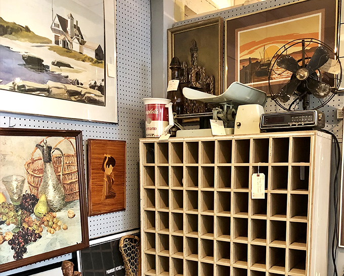 Vintage artwork, retro fans, and industrial artifacts create a time-traveler's paradise where one person's outdated technology becomes another's prized collection.