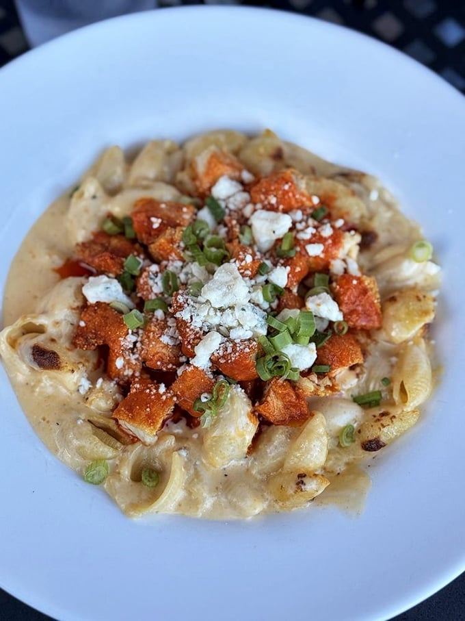 Mac and cheese that's had a glow-up. Those crispy buffalo bites and blue cheese crumbles transform comfort food into a culinary event.