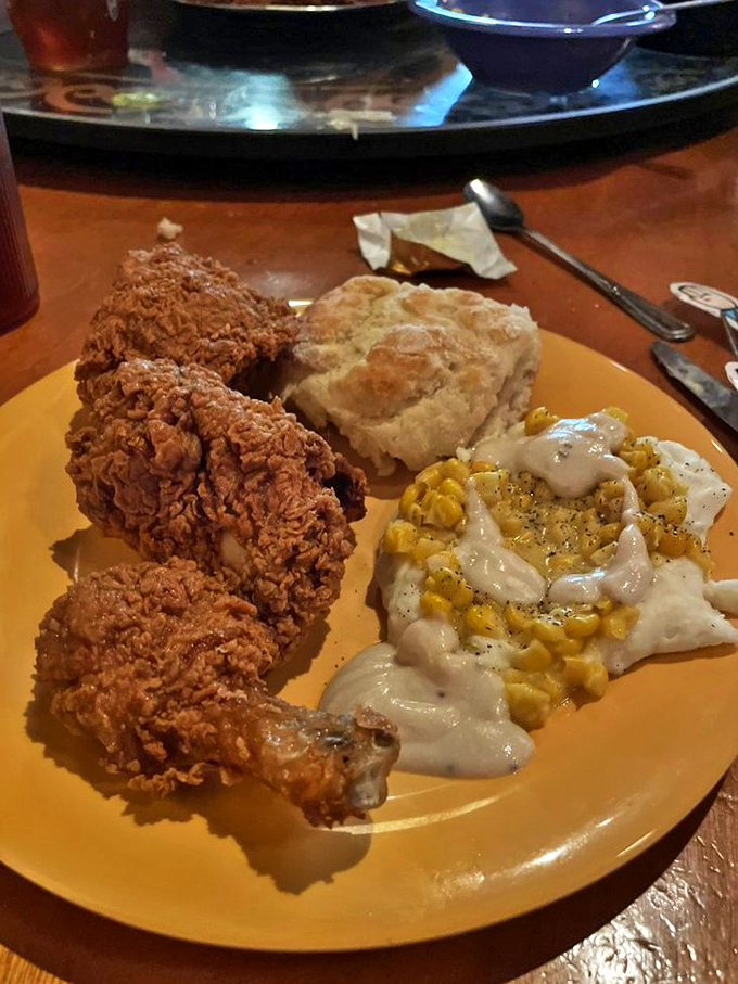 A plate that tells the story of Southern comfort &ndash; fried chicken, biscuits, and cream-covered corn forming the holy trinity of satisfaction.