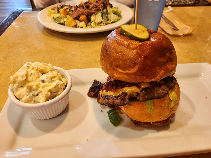 A burger that requires both hands and a strategy. That golden brioche bun barely contains the smoky, juicy patty&mdash;and that's exactly how it should be.